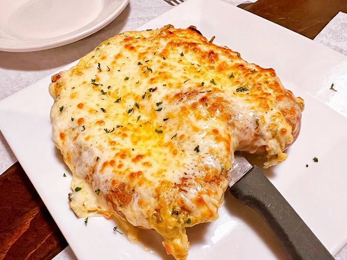 The Crabby Pretzel isn't just food, it's architecture—a masterpiece of melted cheese and lump crab that makes you question why all pretzels aren't dressed this way.
