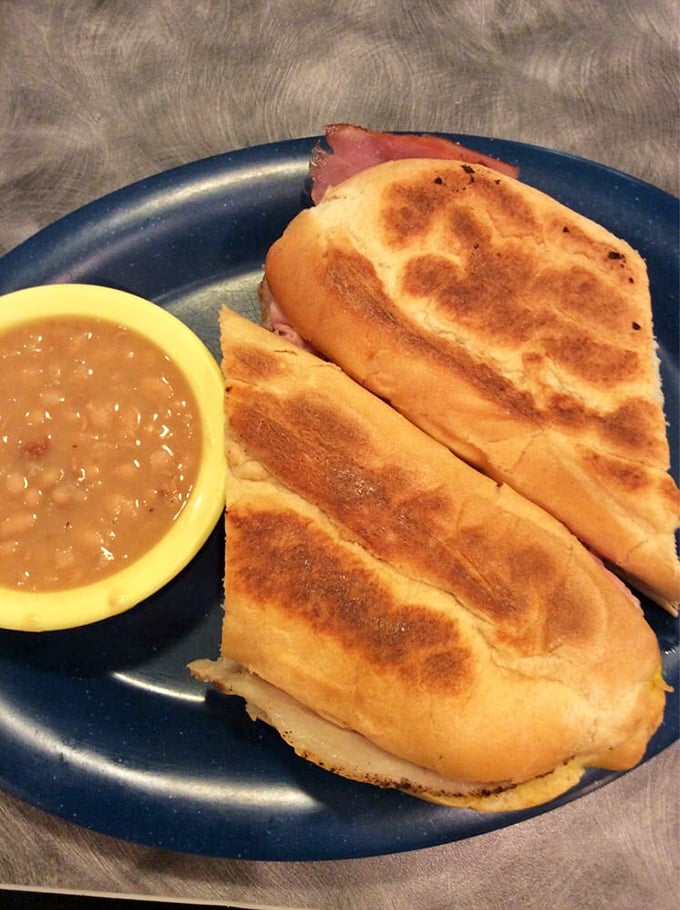 A sandwich that bridges cultures and satisfies souls. Golden-pressed Cuban with a side of beans that clearly simmered all day while telling stories.