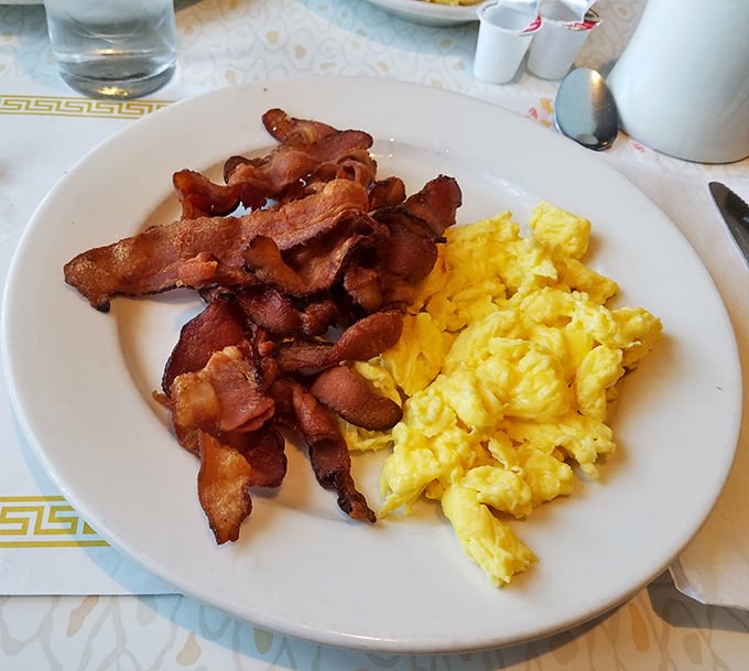 Breakfast perfection doesn't need fancy plating. These eggs are sunshine on a plate, and that bacon? Crispy enough to make a cardiologist nervous.