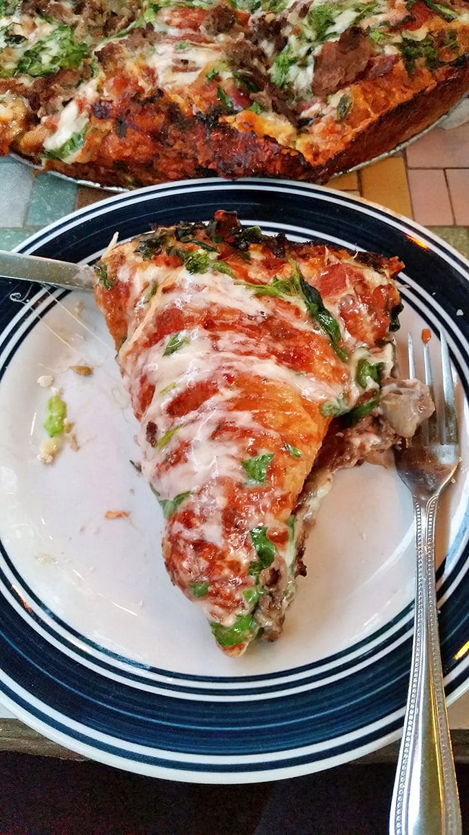 This isn't just pizza – it's a geological event, with layers of toppings, cheese, and sauce that would make the Grand Canyon jealous.