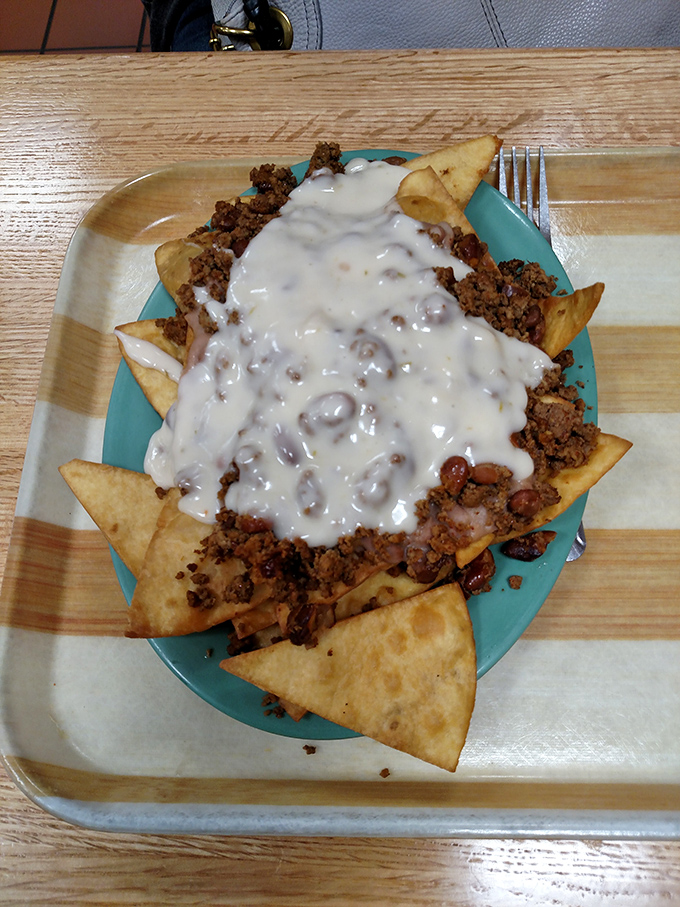 These nachos don't just speak to you; they sing a full opera. The beans and beef create a harmony that Mozart would envy.