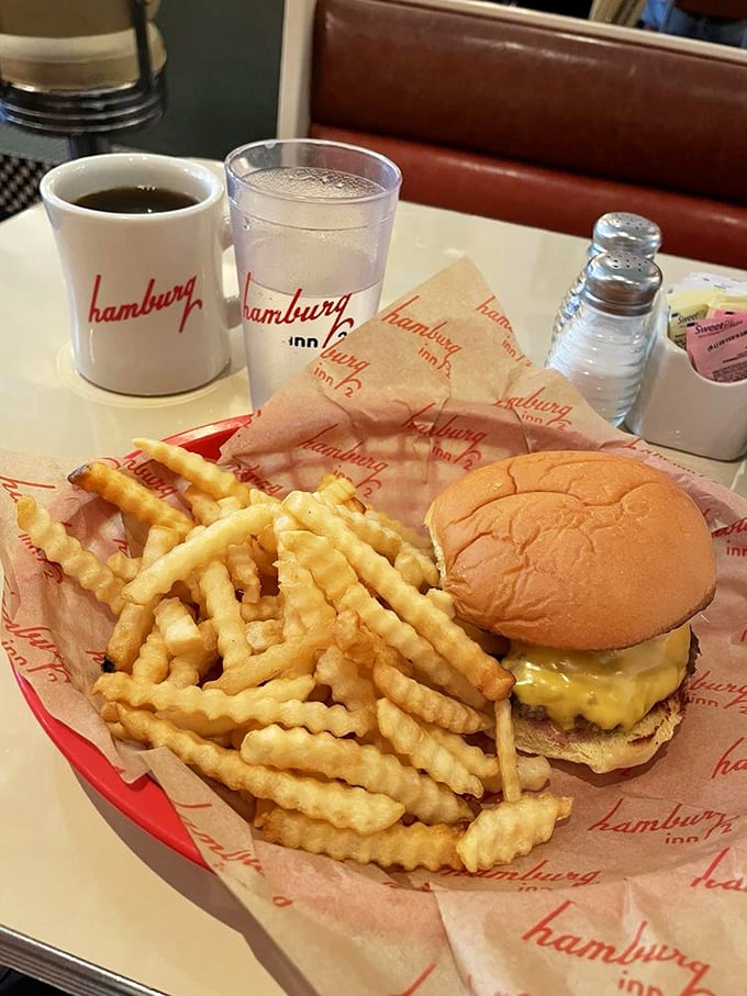 The classic Hamburg Inn experience: crinkle-cut fries, a perfectly melted cheeseburger, and coffee in a mug that's seen more stories than a bartender on Saturday night.