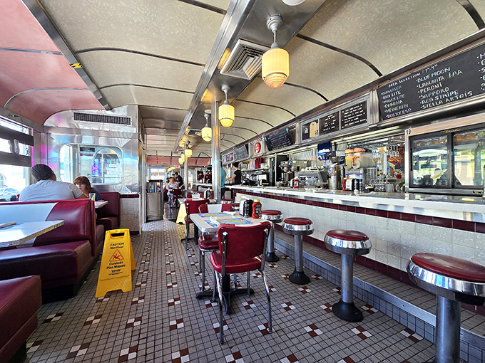 The classic diner counter experience—where strangers become friends over coffee refills and the sizzle of the grill provides the soundtrack to your morning.
