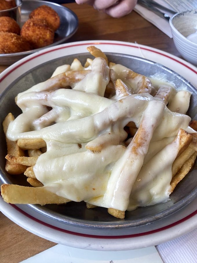 New Jersey's beloved disco fries—where French fries meet their destiny under a blanket of melted cheese and gravy. Midnight salvation on a plate.