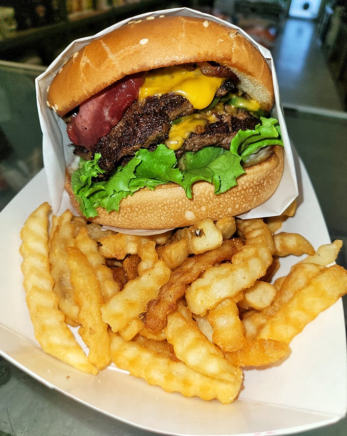 This isn't just a burger—it's edible architecture with layers of beef, cheese, and fresh veggies that somehow defy gravity.