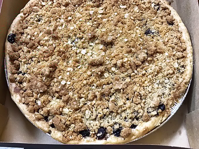 This blueberry crumb pie isn't just dessert—it's edible Michigan summer, captured in a perfect buttery crust time capsule.