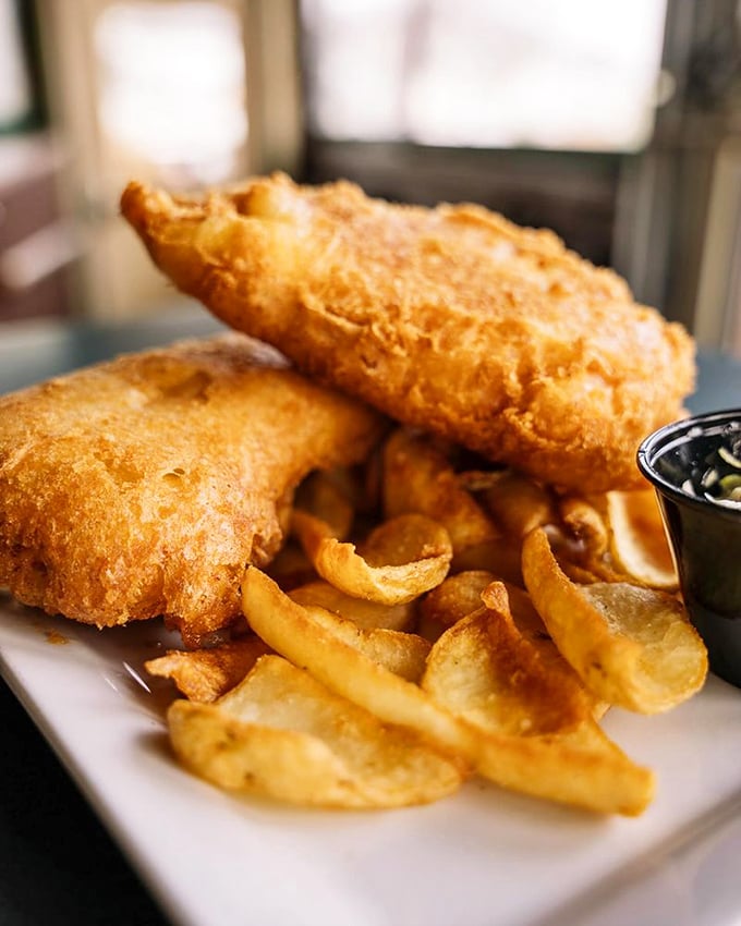 Beer-battered fish and chips done right - crispy, flaky perfection that would make any Dubliner proud.