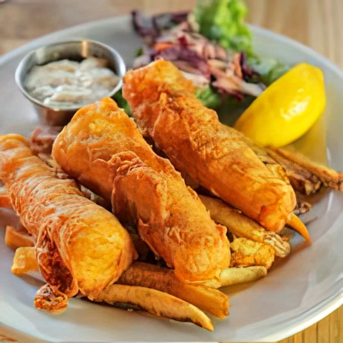 The star of the show: beer-battered fish with a crackling exterior giving way to flaky, tender cod. This isn't just food—it's edible joy.