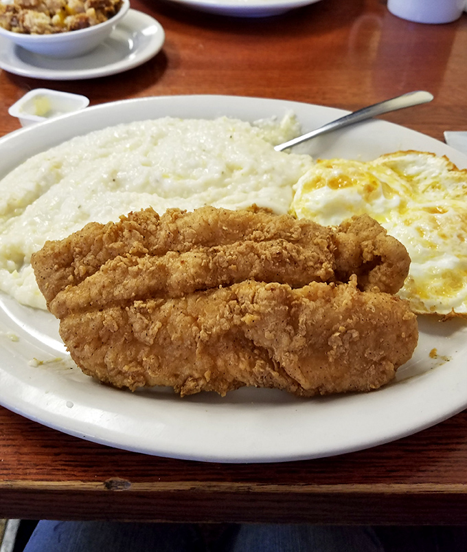 Country-fried steak that could make a vegetarian weep with temptation. Those creamy grits and sunny-side-up eggs are the supporting actors in this breakfast drama.