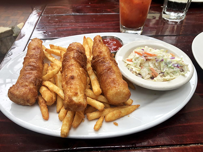 These golden-battered fish fillets aren't just fish and chips—they're crispy vessels of happiness served with a side of coastal nostalgia.