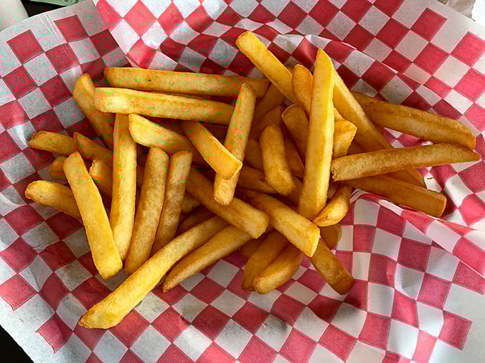 Golden, crispy, perfectly salted—these fries aren't just a side dish, they're the reason some folks claim their car "automatically turns" into Burger Inn's lot.