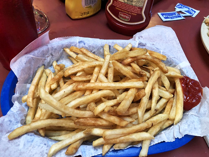 French fries so perfectly golden they deserve their own trophy. Crisp exterior, fluffy interior—the platonic ideal of what a fry should be.