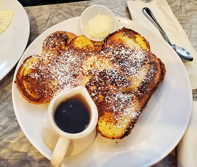 French toast so perfectly golden and powdered-sugar dusted, it makes you wonder if your grandma snuck into the kitchen when nobody was looking.