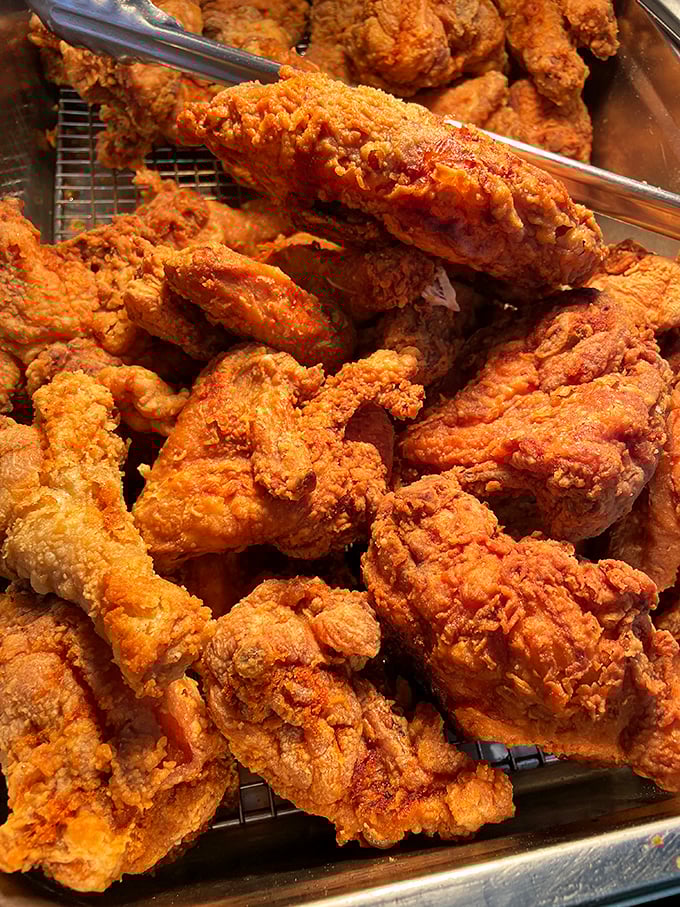 Behold the chicken that launched a thousand food pilgrimages, its crust shattering with each bite like crispy love letters to your palate.
