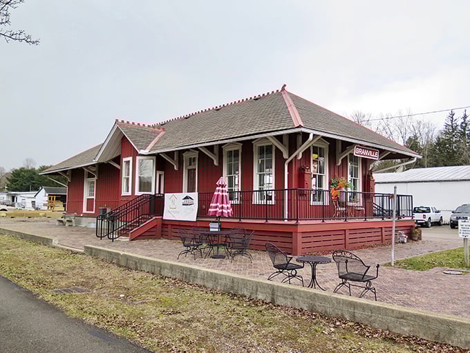 This crimson depot isn't just Instagram-worthy; it's a charming reminder of when train whistles, not notification pings, announced arrivals.