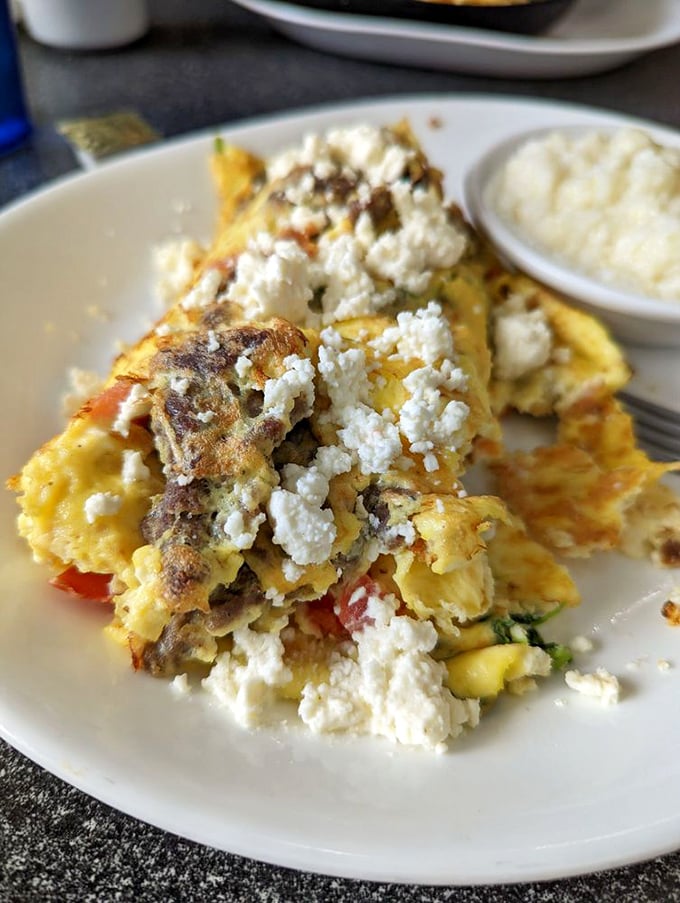 This Greek omelet doesn't just have feta cheese—it has enough to make Zeus himself nod in approval. The side of grits completes this Southern-meets-Mediterranean alliance.