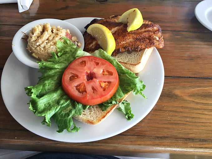 The legendary grouper sandwich in all its blackened glory—where the fish is the star and everything else is just supporting cast.