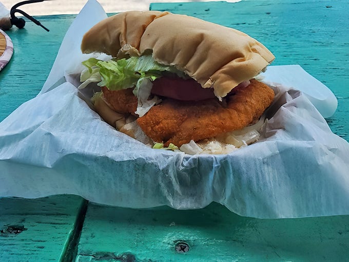 The sandwich that launched a thousand return trips. Crispy fried fish spilling out of Cuban bread—a beautiful mess worth every napkin.