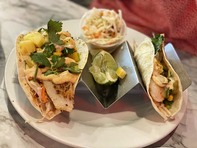 Fish tacos that look like edible postcards from paradise. The fresh cilantro and pineapple salsa add tropical flair to perfectly grilled fish – no passport required. 