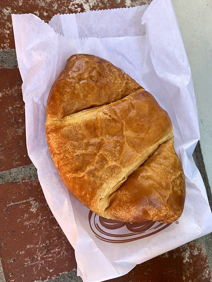 The humble croissant, perfectly executed—golden, flaky, and substantial. This isn't some dainty European affectation; this is breakfast with purpose.