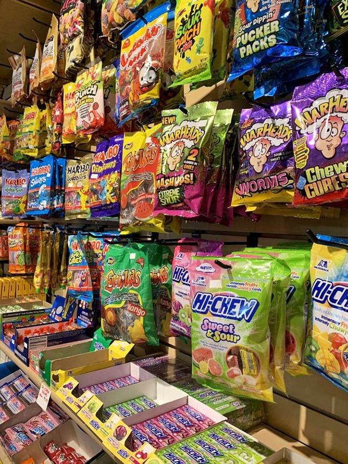 The candy aisle that time forgot. Warheads, Sour Patch, and Hi-Chew packages create a nostalgic tapestry of sweet and sour memories.