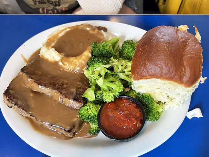The holy trinity of comfort: meatloaf, mashed potatoes, and gravy. Add broccoli for the illusion of health-consciousness we all need.