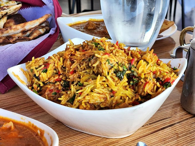 This isn't just rice; it's biryani—a technicolor dream of spices where each grain tells a different story. Turmeric never looked so tempting.