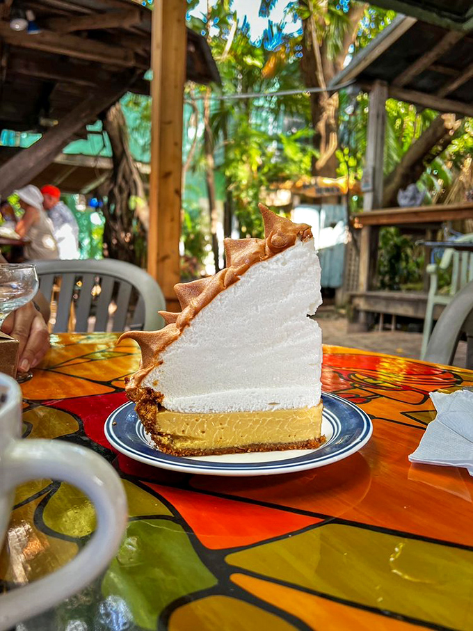 That famous mile-high meringue key lime pie isn't just dessert—it's architecture. The tropical backdrop makes it taste even better, if that's possible.