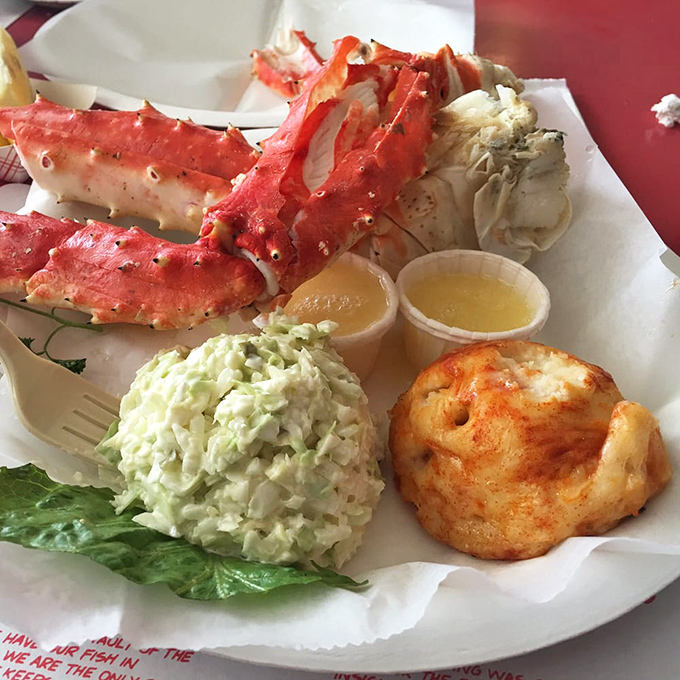 King crab legs that require no embellishment beyond butter, served with that famous coleslaw that puts picnic versions to shame.