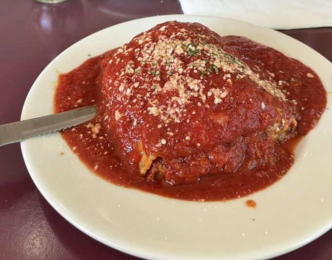 This isn't just lasagna; it's an archaeological dig through layers of Italian-American history, with each forkful revealing new depths of flavor.
