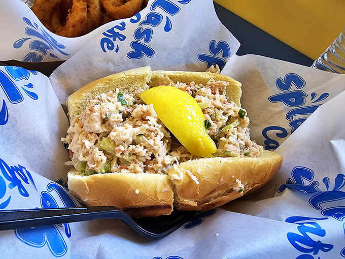 This lobster roll isn't just lunch; it's a coastal vacation between two pieces of bread. The lemon wedge isn't garnish – it's essential equipment.