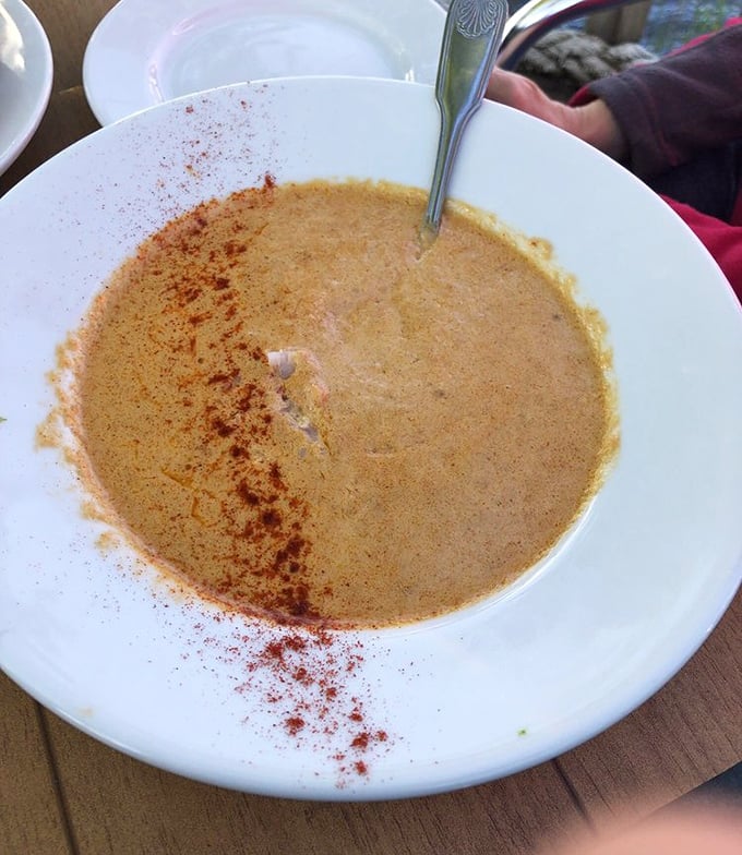 The lobster bisque arrives with a dusting of spice like sunset on the water. Each spoonful is a velvety reminder of why soup can be a destination, not just a starter.