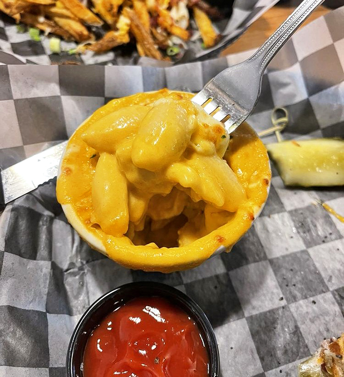 The fork-lift moment we all live for—when perfectly cooked pasta meets molten cheese sauce. A symphony of comfort in every bite.