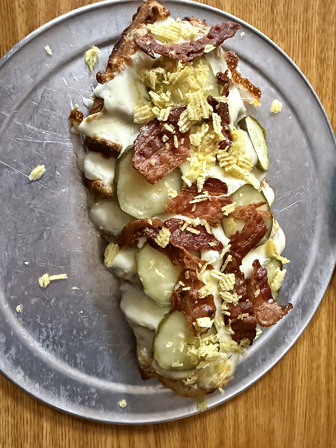 Bacon and potatoes having a cheese party on a waffle. This is the breakfast equivalent of getting upgraded to first class.