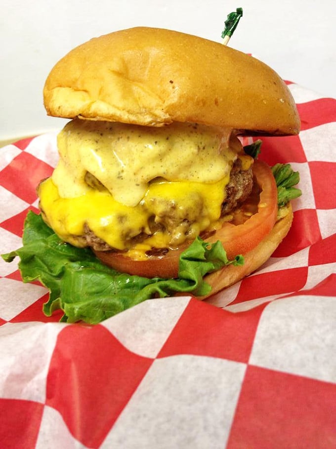Cheese cascading down like a yellow waterfall of joy. This isn't just a burger—it's edible architecture with purpose.