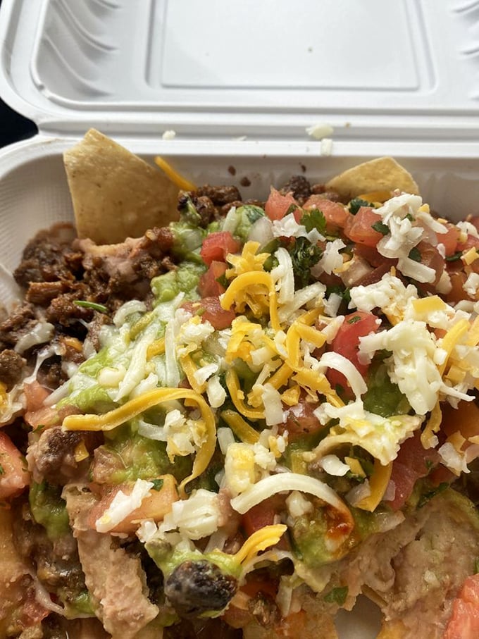 The holy trinity of meat, cheese, and guacamole. These nachos don't just speak to you—they sing a full mariachi serenade.