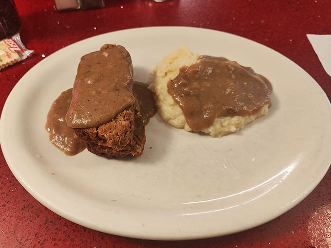 Behold the meatloaf in all its gravy-drenched glory! This isn't just dinner—it's edible therapy after a long New England day.