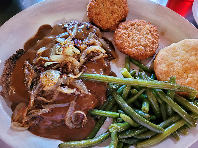 This isn't just dinner; it's a comfort food trilogy—perfectly seared meatloaf, crispy-edged biscuits, and green beans that actually make you want to eat vegetables.