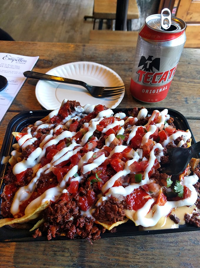 Meat lovers, rejoice! These nachos don't just have toppings—they have ambitions. That Tecate is about to witness something beautiful.