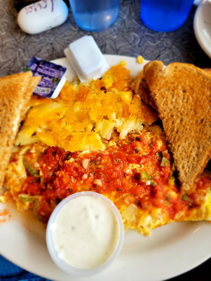 This Mexican omelet doesn't just sit on the plate—it commands attention with its vibrant salsa and that golden crown of home fries.
