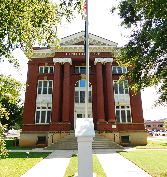 The County Courthouse's brick facade and white columns create that perfect blend of authority and charm—like a stern judge who secretly bakes cookies.