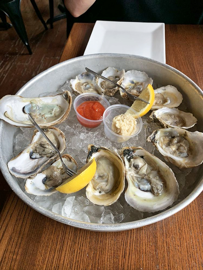 Fresh oysters on ice with classic accompaniments—proof that sometimes the simplest preparations let truly great ingredients shine. Each one tastes like a perfect day at the shore.