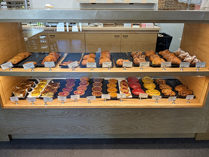 The pastry case at Ken's doesn't just display baked goods—it exhibits edible art that makes museum curators jealous and dieters reconsider their life choices.