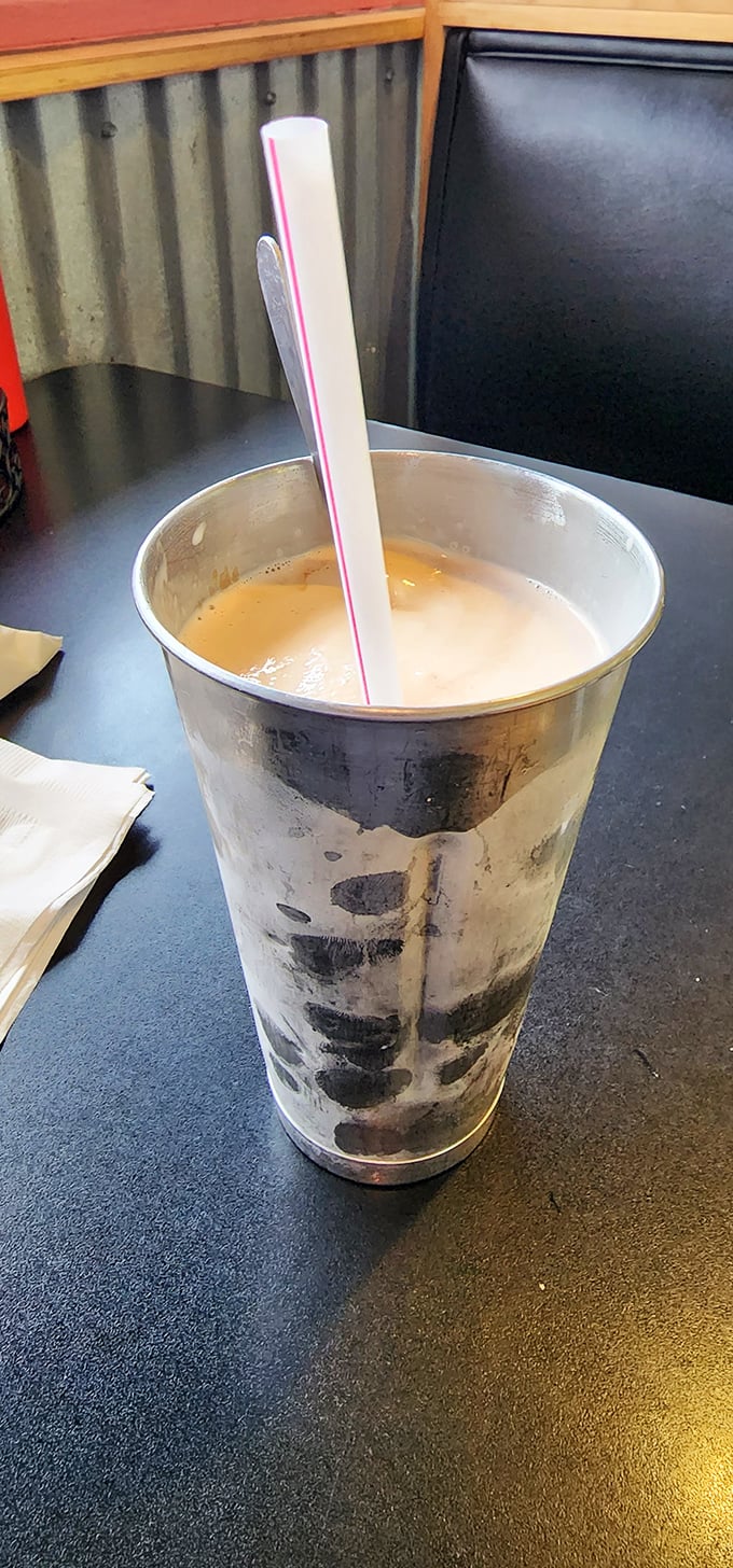 The metal mixing tin isn't just nostalgic—it's practical engineering. That extra milkshake waiting in the wings is like finding money in last year's coat pocket.