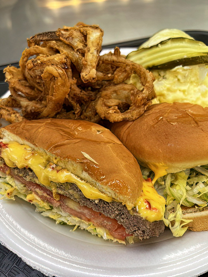 The pimento cheeseburger with crispy onion rings—where Southern tradition meets cardiac adventure. Worth every extra minute on the treadmill tomorrow.