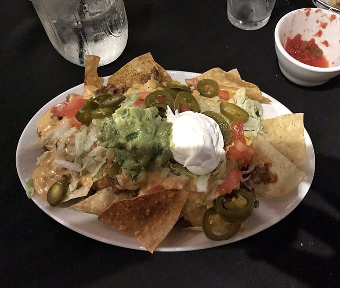 The nacho mothership has landed! Guacamole, sour cream, and jalapeños create a flavor cosmos that's worth every messy bite.