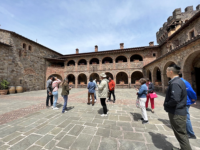 The courtyard where medieval architecture meets modern tourism. Notice nobody's checking their phone—the stone walls have that effect on people.