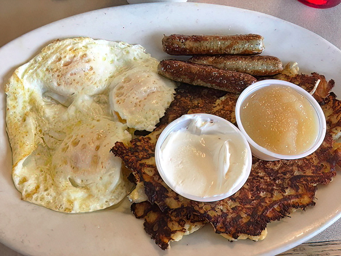 The Potato Pancake Breakfast brings together crispy potato pancakes, eggs, and sausage links—a trio more harmonious than The Supremes in their prime.