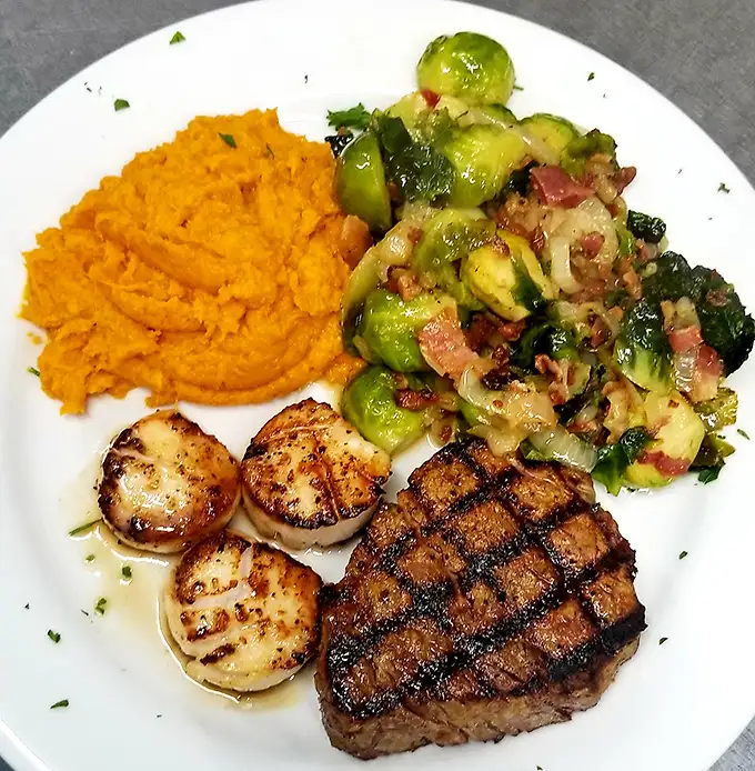 Perfectly cross-hatched grill marks on this steak aren't just for show—they're flavor geography mapping out your next several moments of bliss.