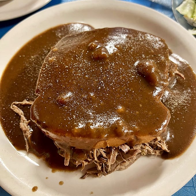 Gravy isn't just a condiment here, it's practically a food group. This hot roast beef sandwich swimming in rich brown gravy makes a compelling case for always keeping a napkin handy.